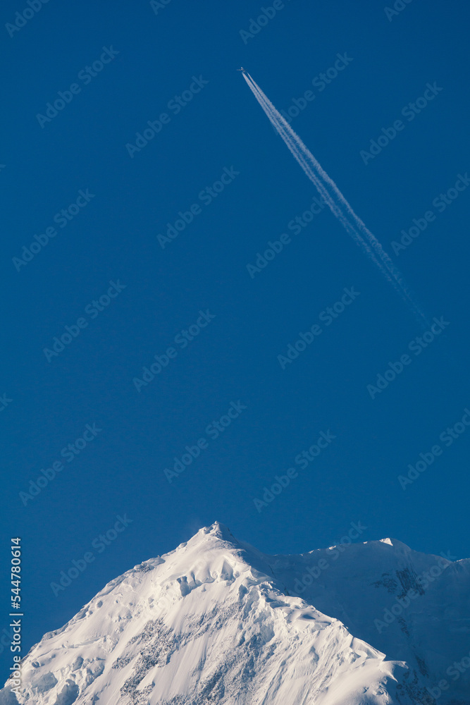 Moning view of Mount Rakaposhi with airplane over it in the Karakoram ...