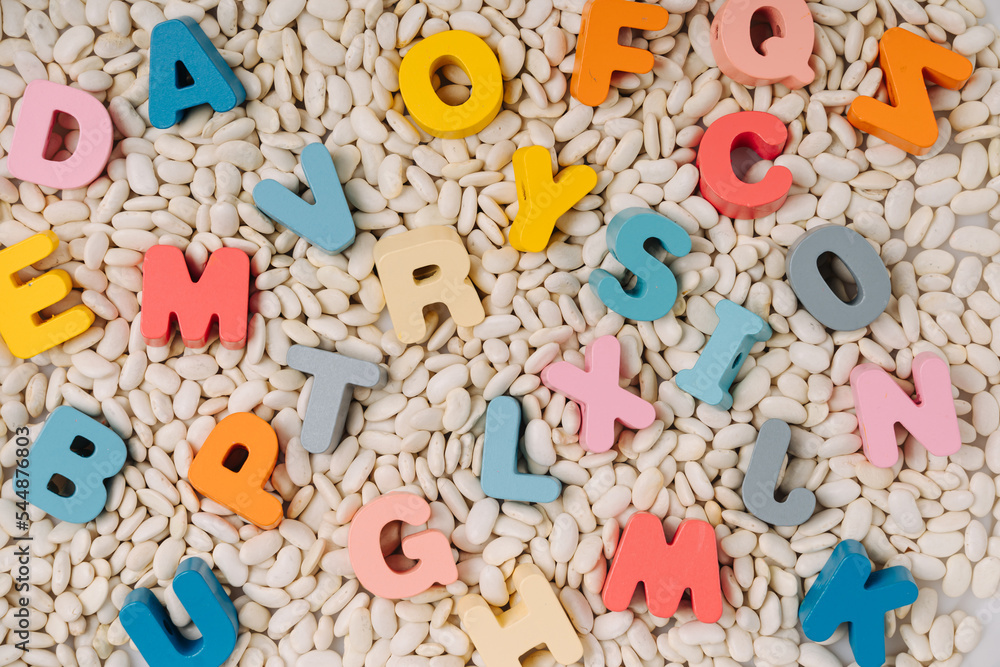 Colorful letters of the alphabet in sensory bin. Primary school or ...