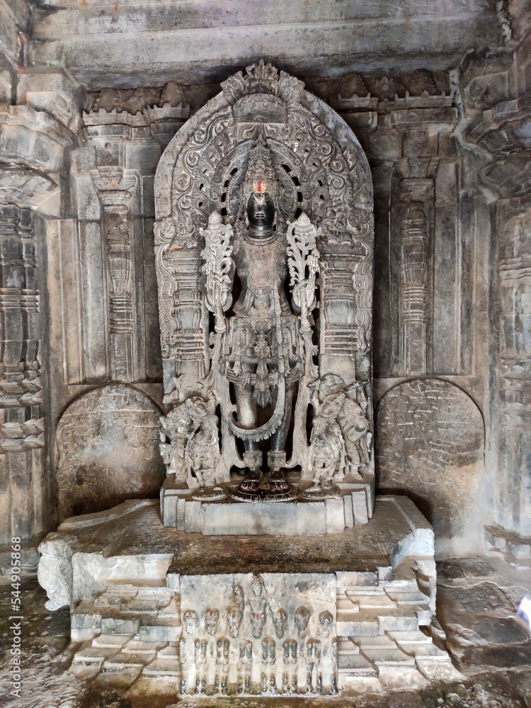 A detailed stone sculpture of Surya, the Sun god, at Hoysaleswara ...