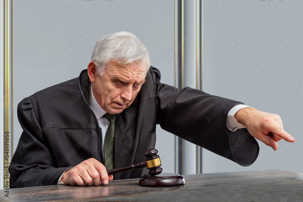 Judge banging judge's gavel, index finger pointing. Law Lord wearing ...