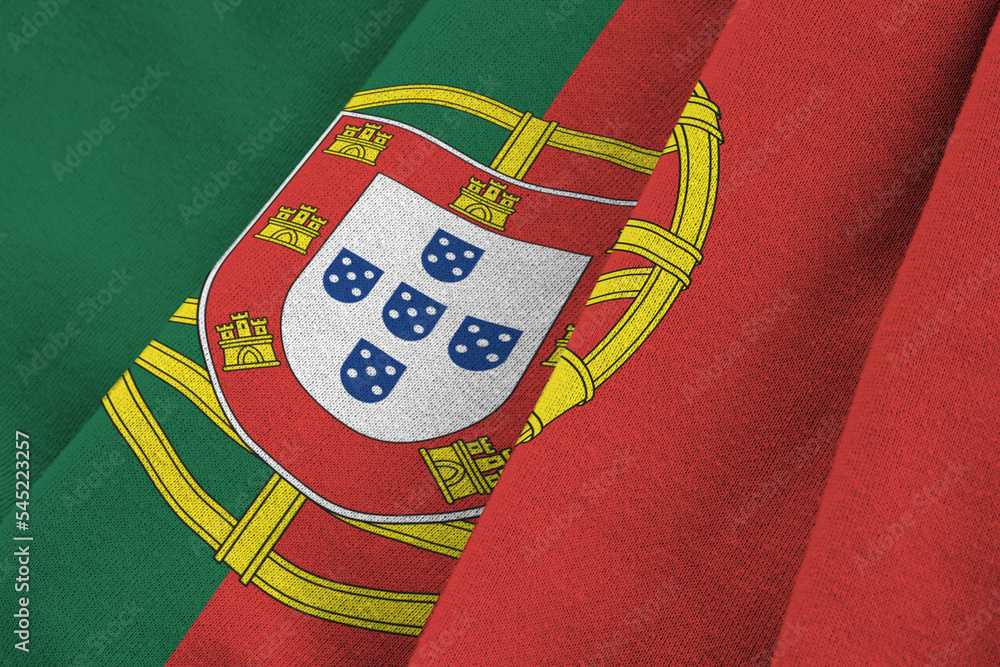 Portugal flag with big folds waving close up under the studio light ...