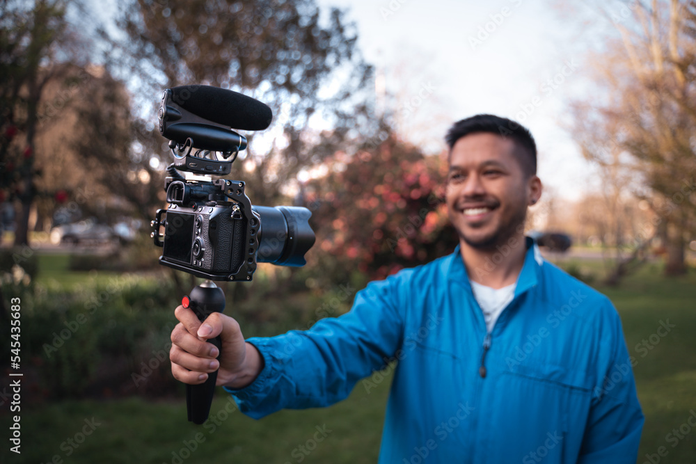 man vlogging with camera Stock Photo | Adobe Stock