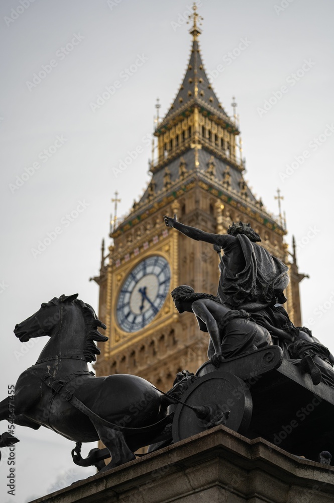 Low angle shot of bronze statue of Boadicea near iconic clock tower Big ...