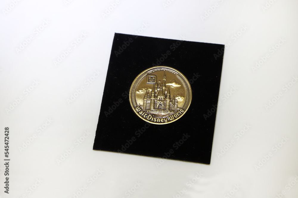 Walt Disney World. Magic Kingdom commemorative coin. Isolated white ...