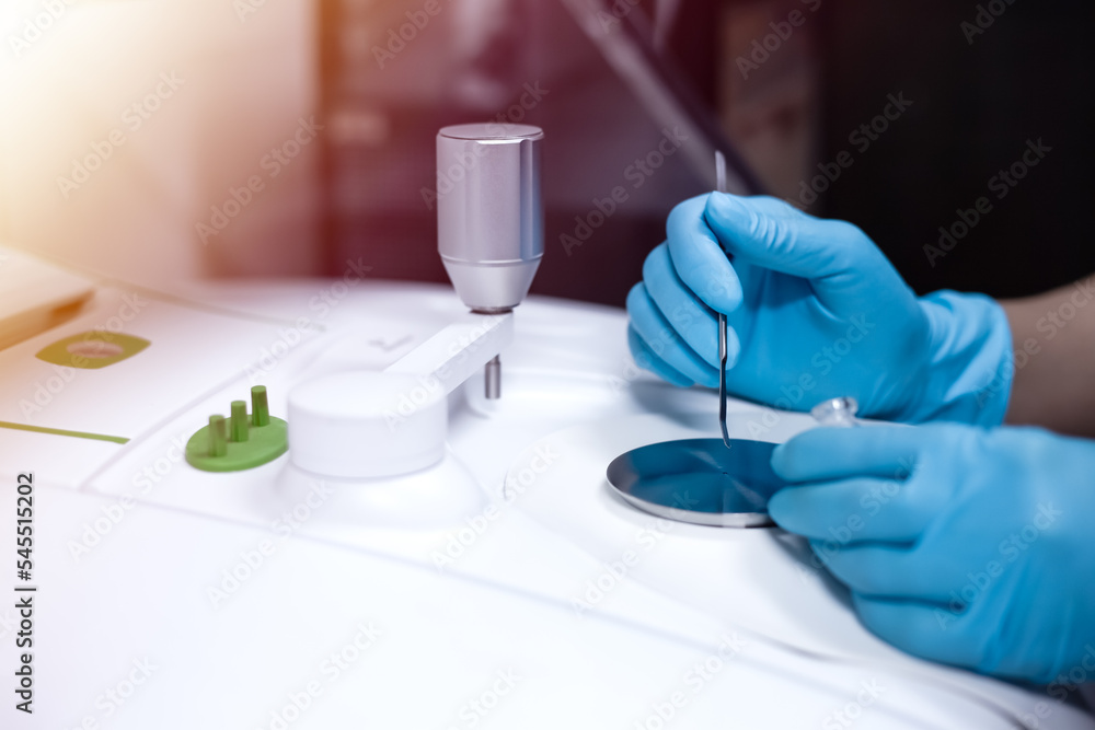 Scientist use the Fourier Transform Infrared spectrometer FTIR to ...