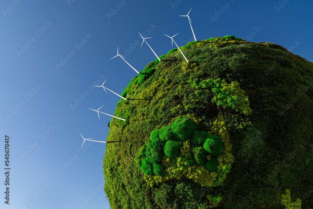 Model of the green planet Earth from moss with wind turbines. Symbol of ...