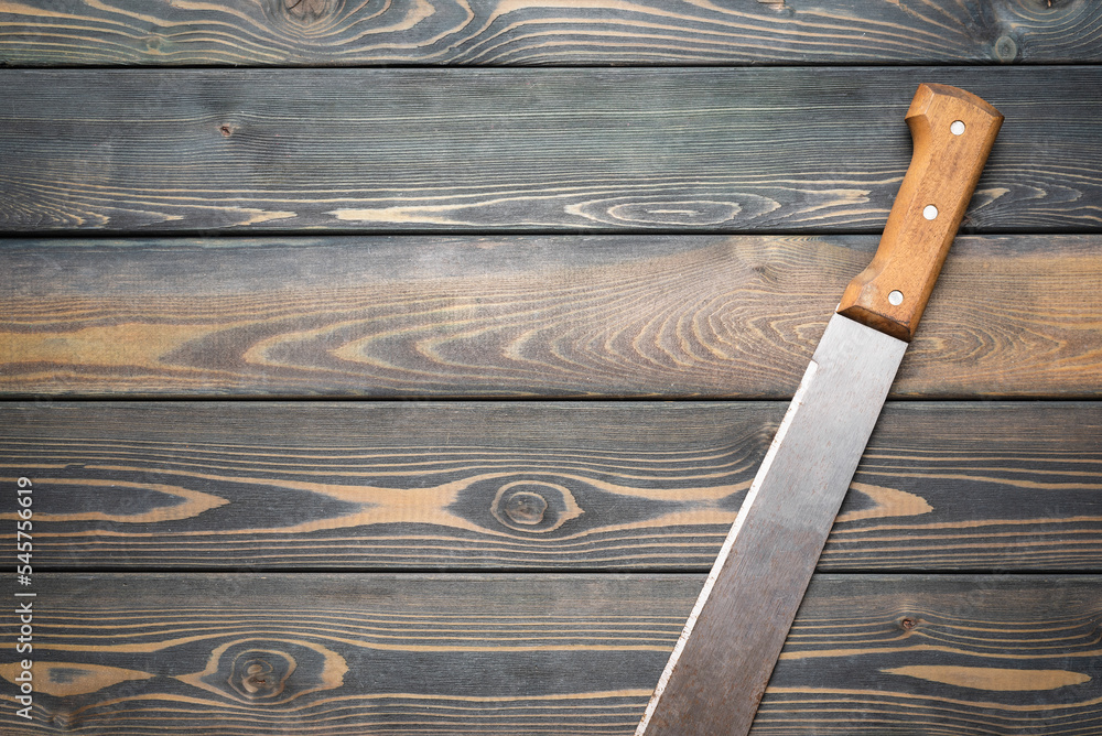 Sharp machete on the old table top view background with copy space ...