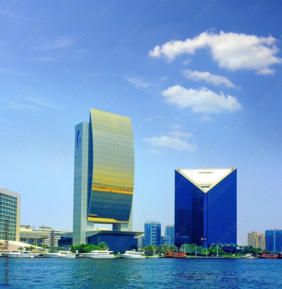 DUBAI, UAE - Modern architecture on the banks Dubai Creek. The creek is ...
