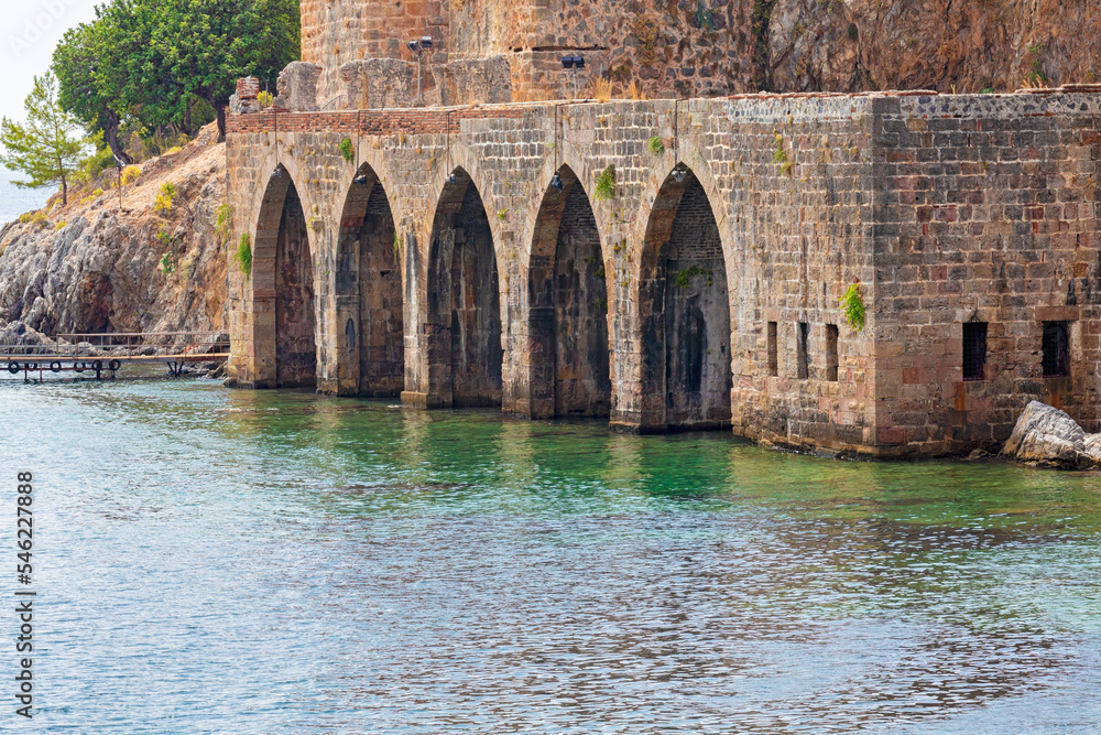 Ancient shipyard (Tersane) near of Kizil Kule tower in Alanya, Turkey ...
