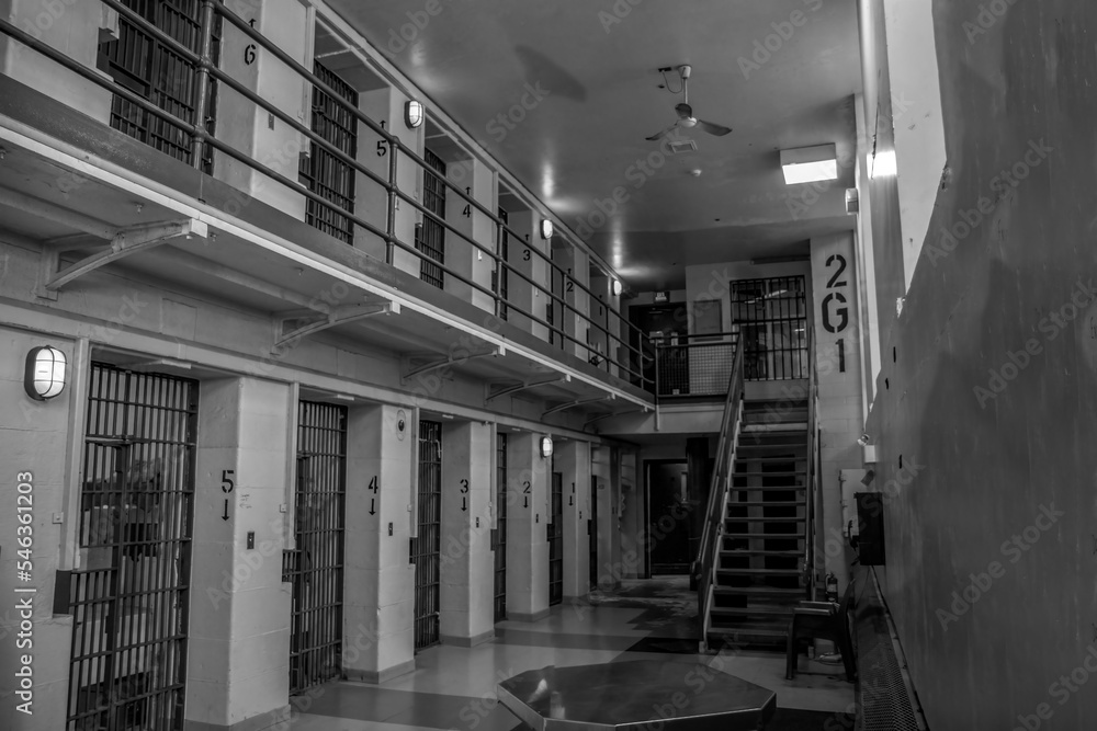 Inside of a prison cell block range showing locked cells with steel ...