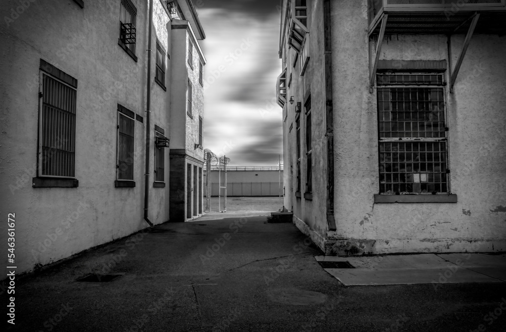 Alleyway between two buildings with barred leading to the exercise yard ...