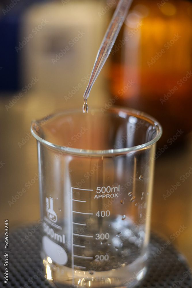 Measuring Liquid in Beaker Stock Photo | Adobe Stock