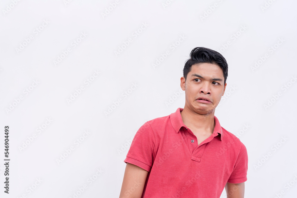 A young asian looking very disgusted, reacting to a cringe inducing ...