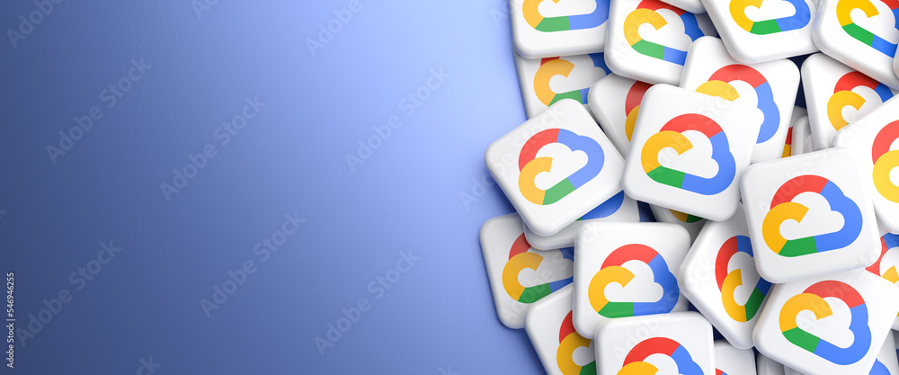 Logos of the Google Cloud services on a heap on a table. Web banner format with copy space ...