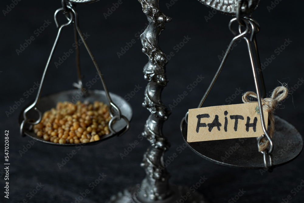 Faith handwritten word on rustic paper and mustard seeds on ancient ...