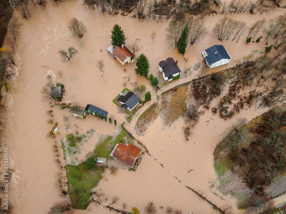 Flooded village, fields, farms and houses, aerial drone view. Aftermath ...