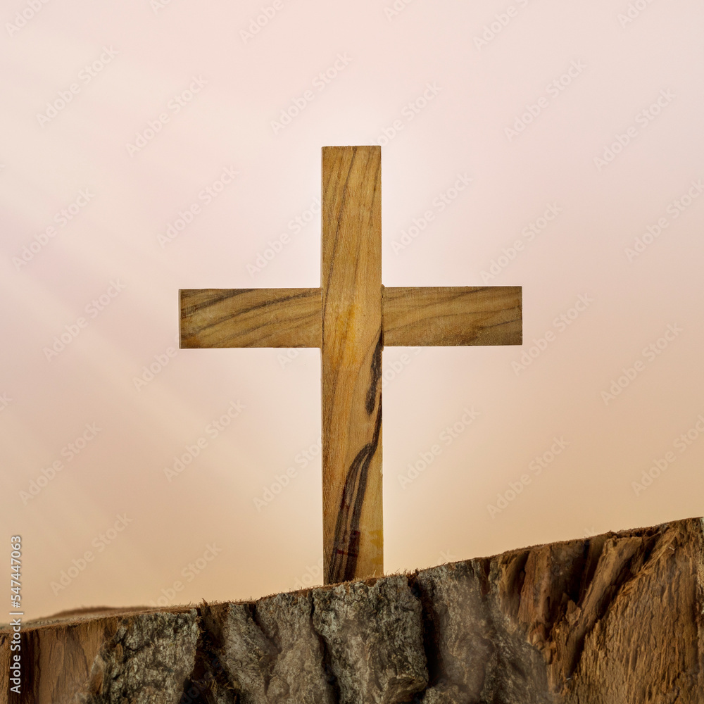 Christian wooden cross on a gradient background with dramatic lighting and sun rays. The Cross ...
