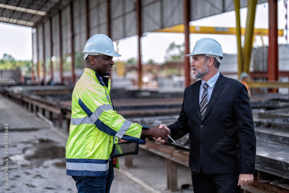 At construction site manager meet engineer check precast concrete slabs ...