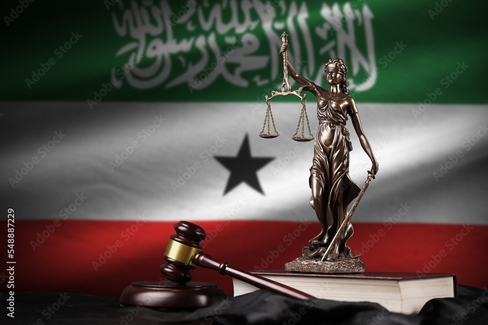 Somaliland flag with statue of lady justice, constitution and judge ...