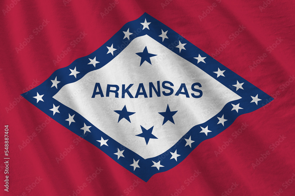 Arkansas US state flag with big folds waving close up under the studio ...