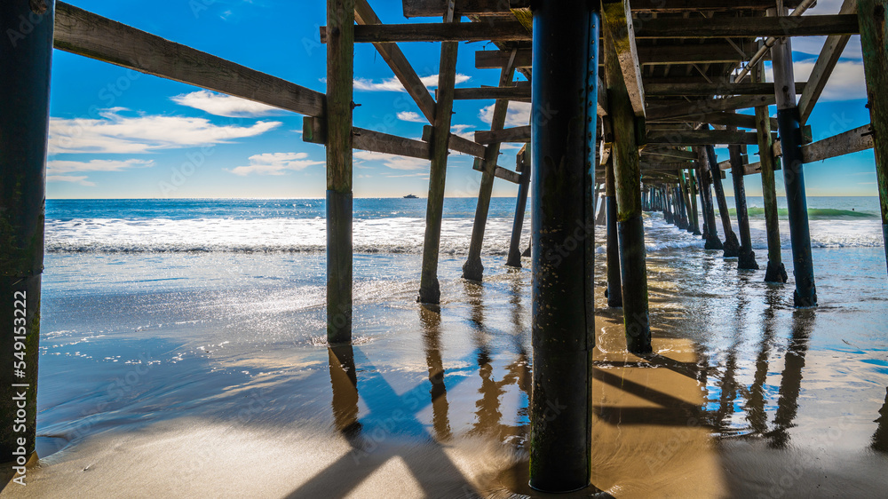 Old piling structure under San Clement Pier at low tide with ...