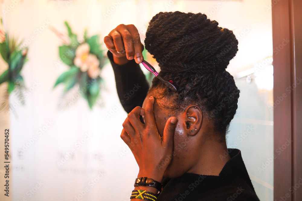 Black girl laying her edges Stock Photo | Adobe Stock