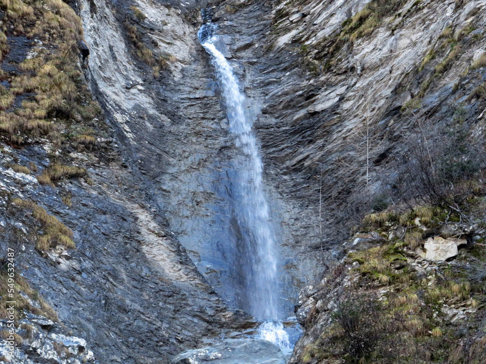 Waterfalls in the wild alpine canyon of Helltobel above in the ...