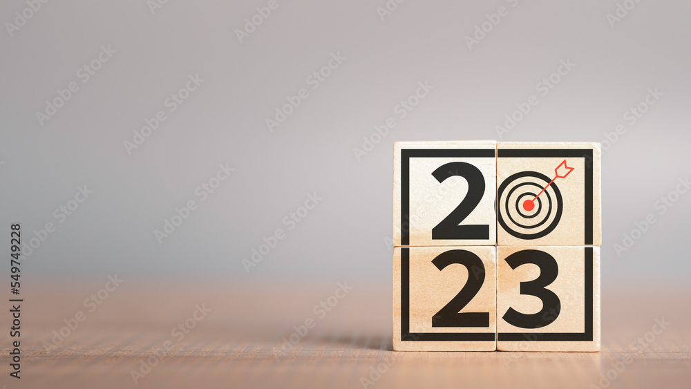 Target plan icon in wooden cubes stack and 2023 business Achievement ...