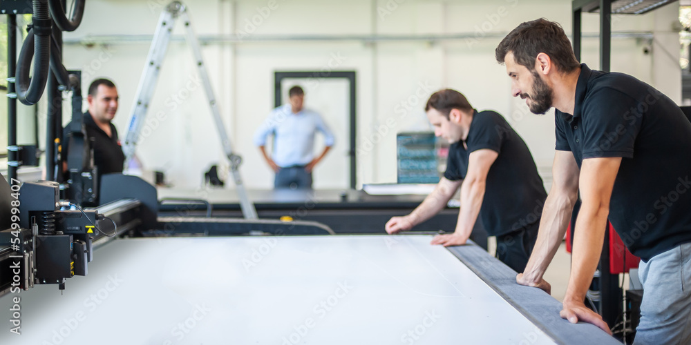 Professional workers graphic technicians operators work in a printing ...