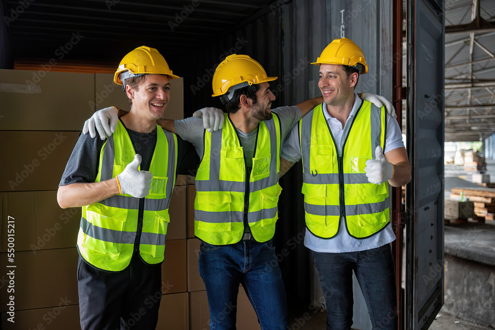 3 Workers carry carton box take from 40 feet steel container on the ...