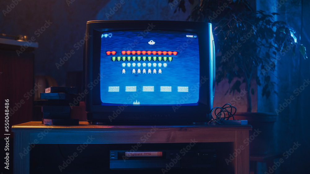 Close Up Footage of a Retro TV Set Screen with an 8 Bit 2D Eighties ...