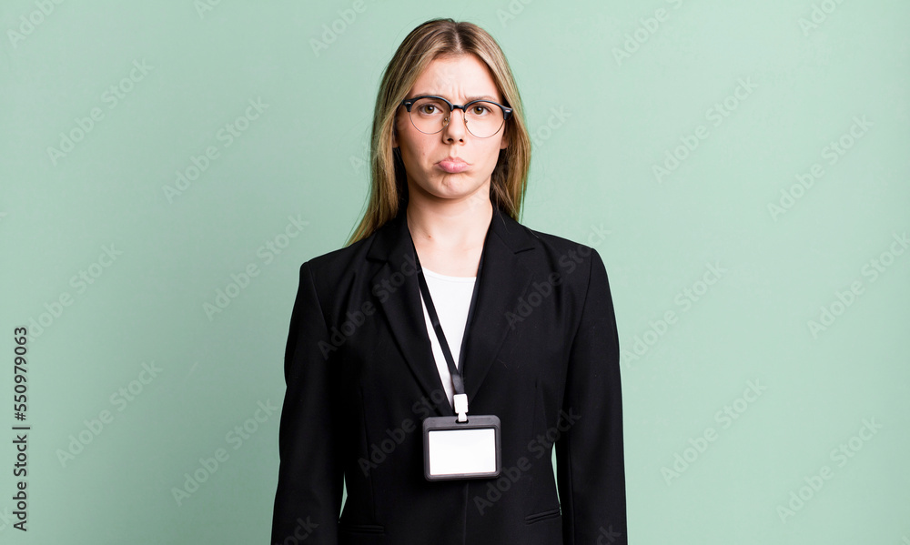 young pretty woman feeling sad and whiney with an unhappy look and ...