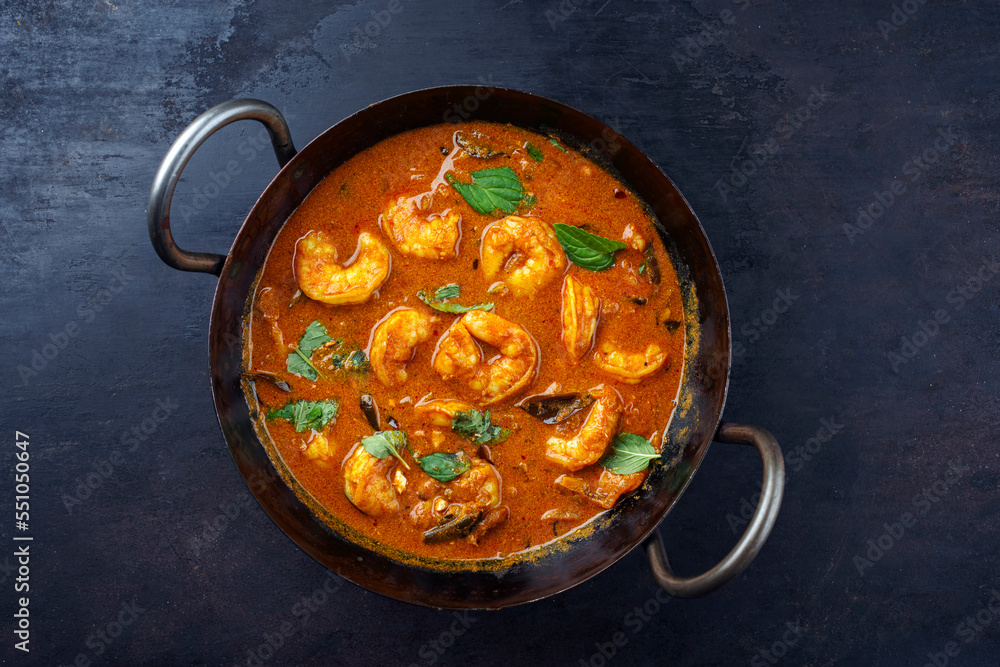 Traditional spicy Indian prawn Madras curry Rogan Josh with king prawns ...