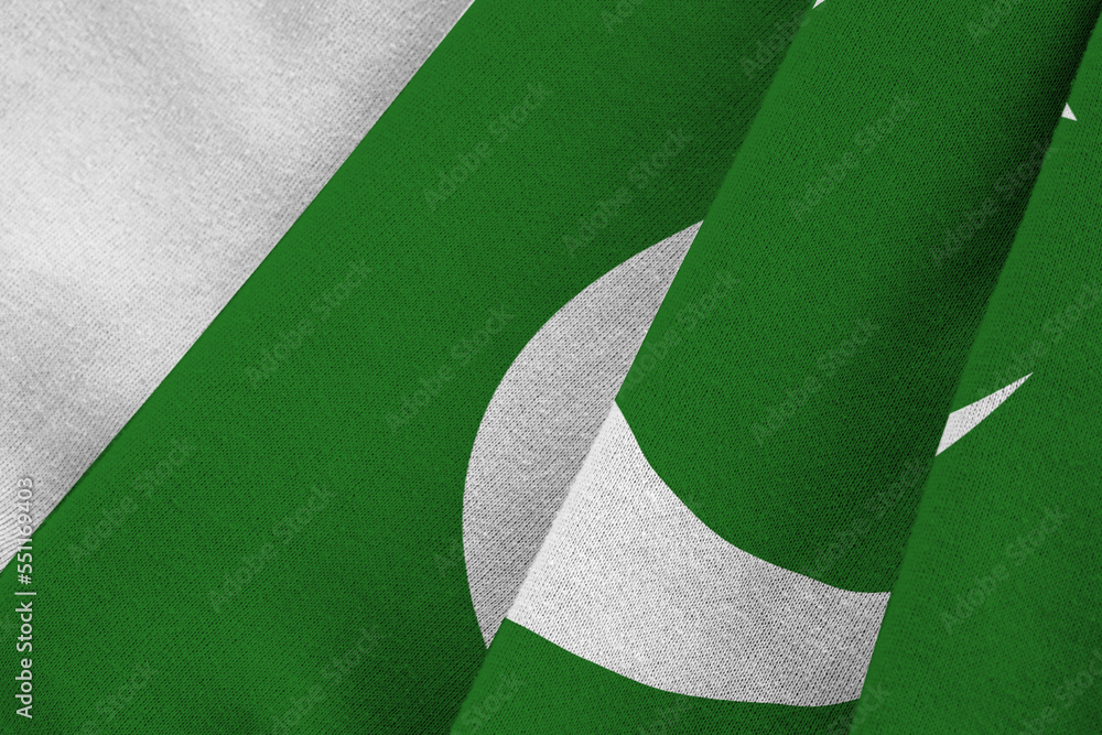 Pakistan flag with big folds waving close up under the studio light ...
