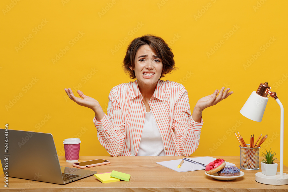 Young successful employee business woman wear casual shirt sit work at ...