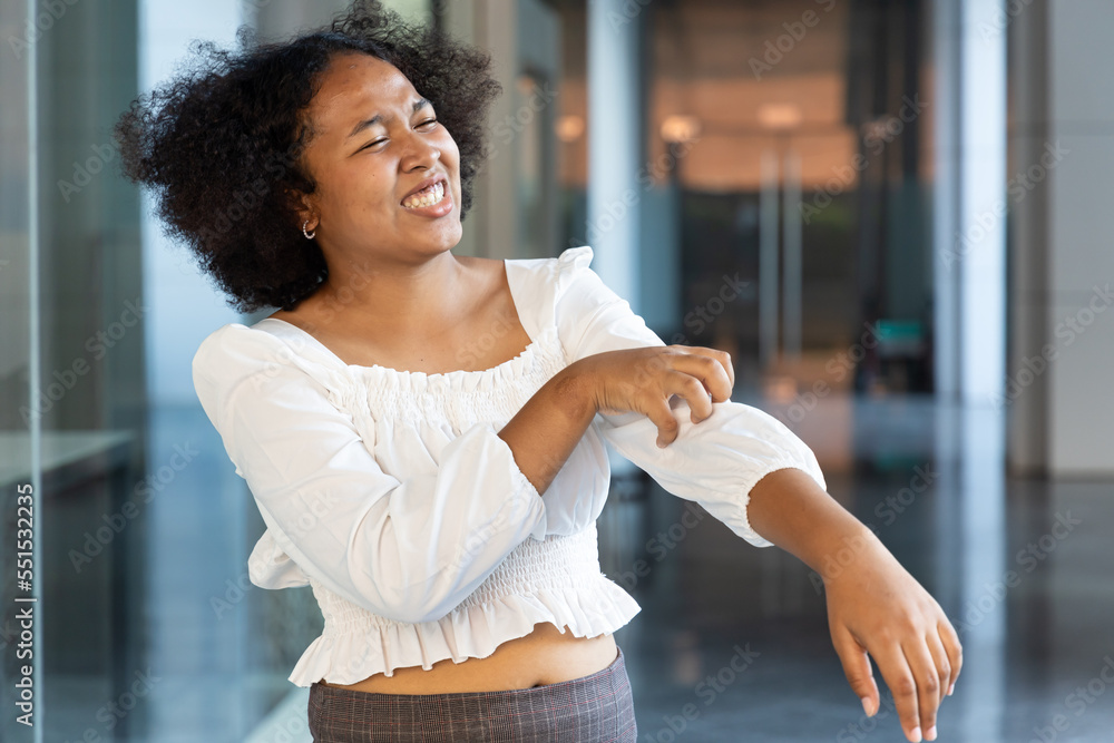 Irritating African woman scratching her arm skin, concept of dry skin ...