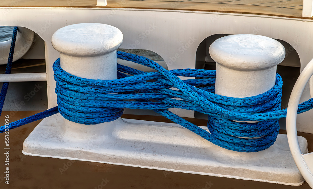 Nautical moorning lines used for mooring a ship. Photo of a double bitt ...