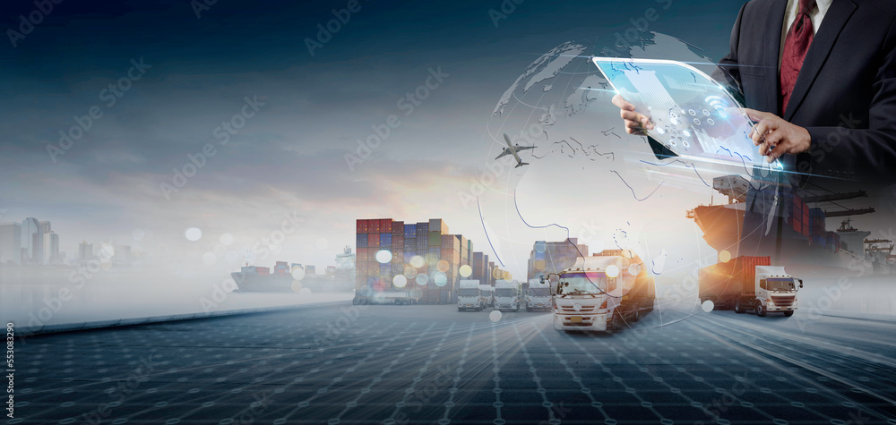 Businessman holding virtual interface panel of global logistics network ...