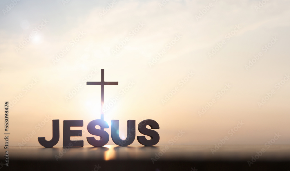 The brightly rising New Year's sunrise and the holy cross of Jesus ...