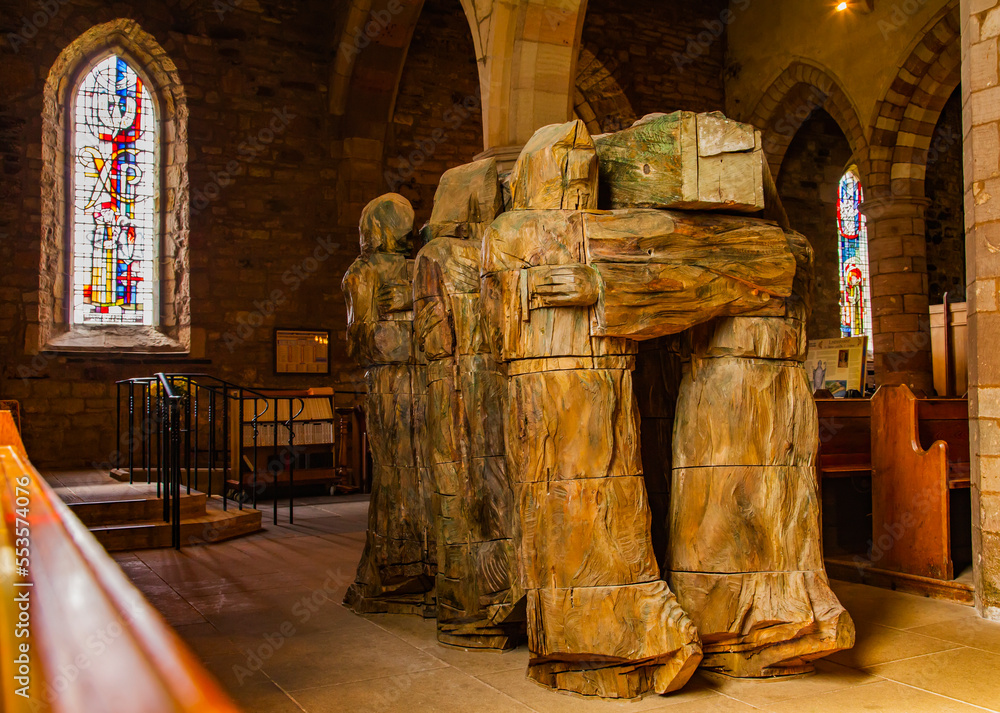 Stock-Foto „View from behind of a carved wooden statue depicting monks ...