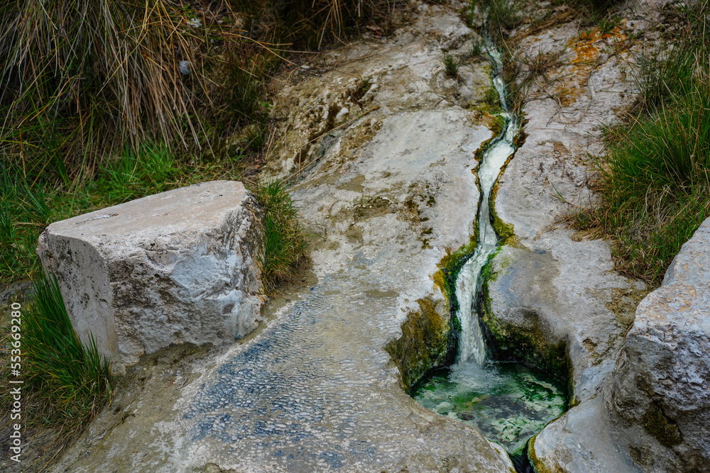 Hot springs at Bagni San Filippo, with calcium carbonate deposits ...
