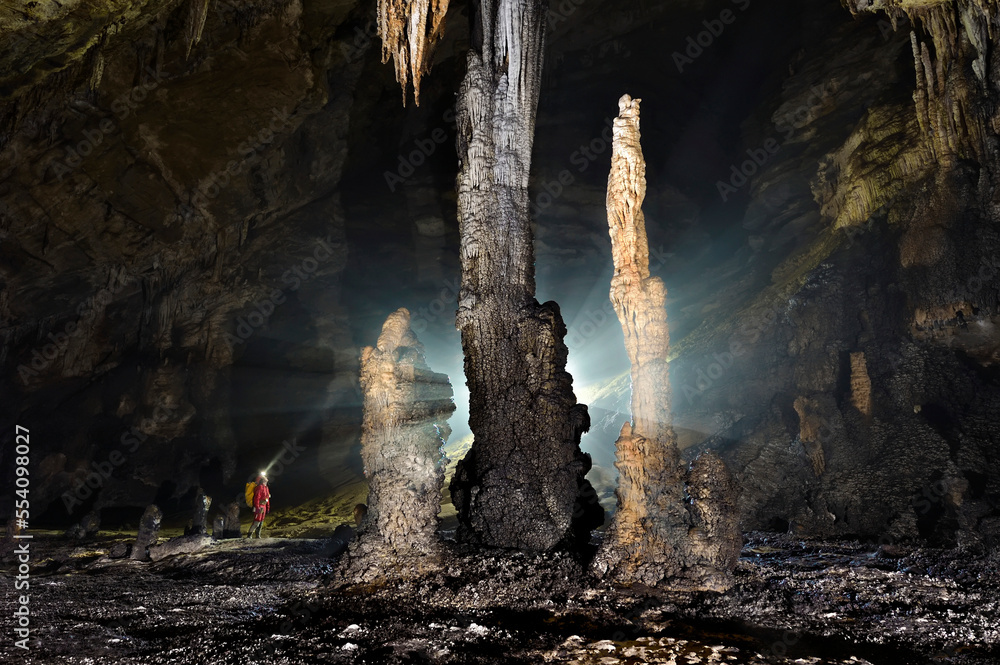 Large stalagmites in San Wang Dong create a spectacle mid way through a ...
