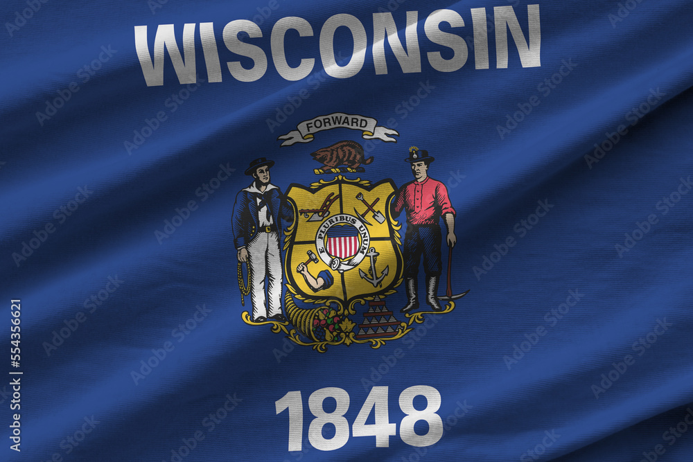 Wisconsin US state flag with big folds waving close up under the studio ...