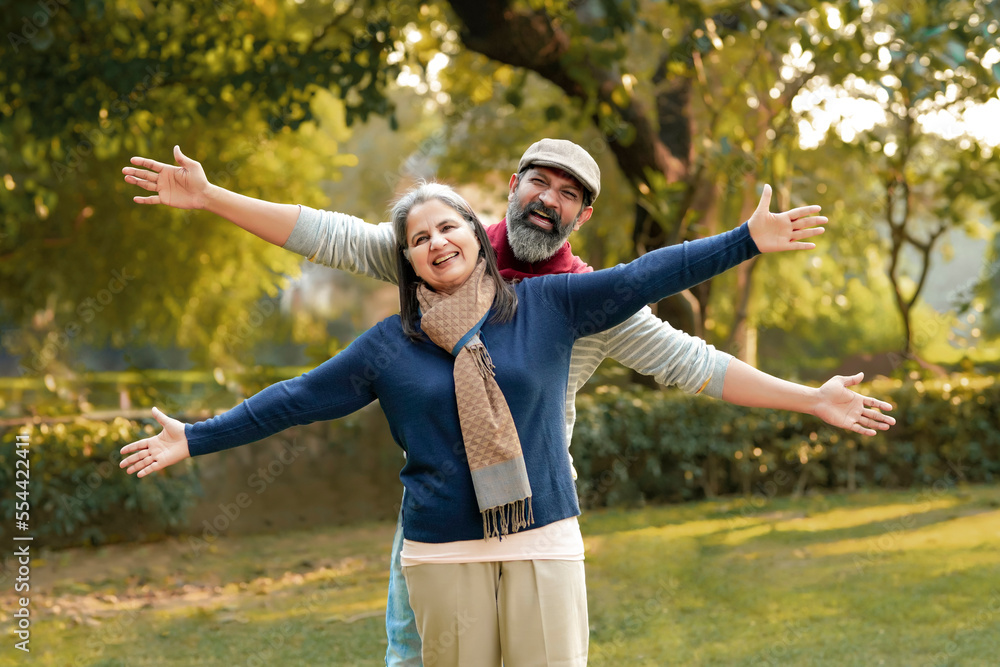 old couple in warm wear in winter at park Stock Photo | Adobe Stock