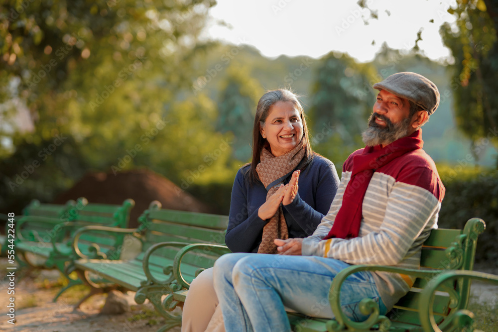 old couple in warm wear in winter at park Stock Photo | Adobe Stock