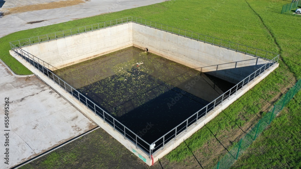Sanitary pit for drainage of water, livestock feces, manure, dirt on an ...