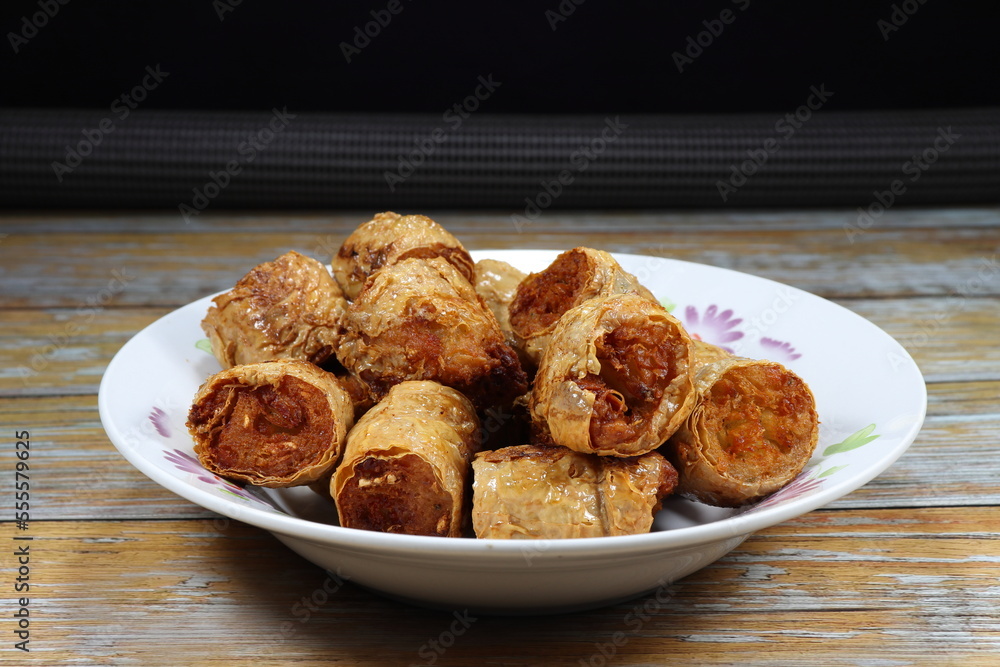 Pile of traditional deep fried tofu sheet wrapped crab meat serving on ...