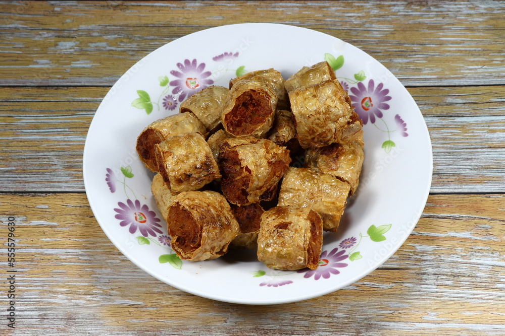 Pile of traditional deep fried tofu sheet wrapped crab meat serving on ...