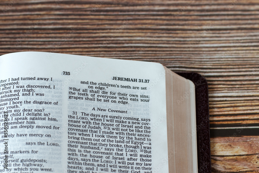 New covenant prophecy verses in open holy bible book. A closeup ...