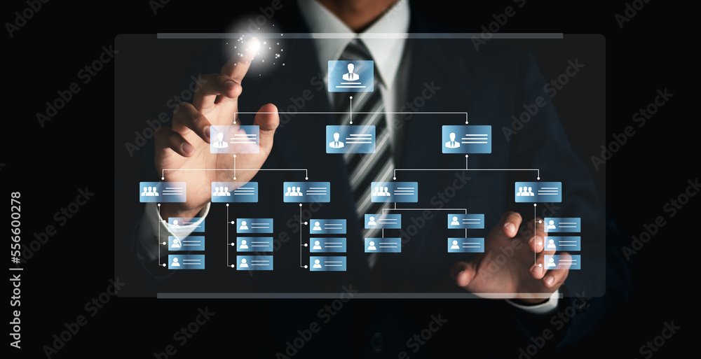 Businessman touching organization chart on virtual interface screen ...